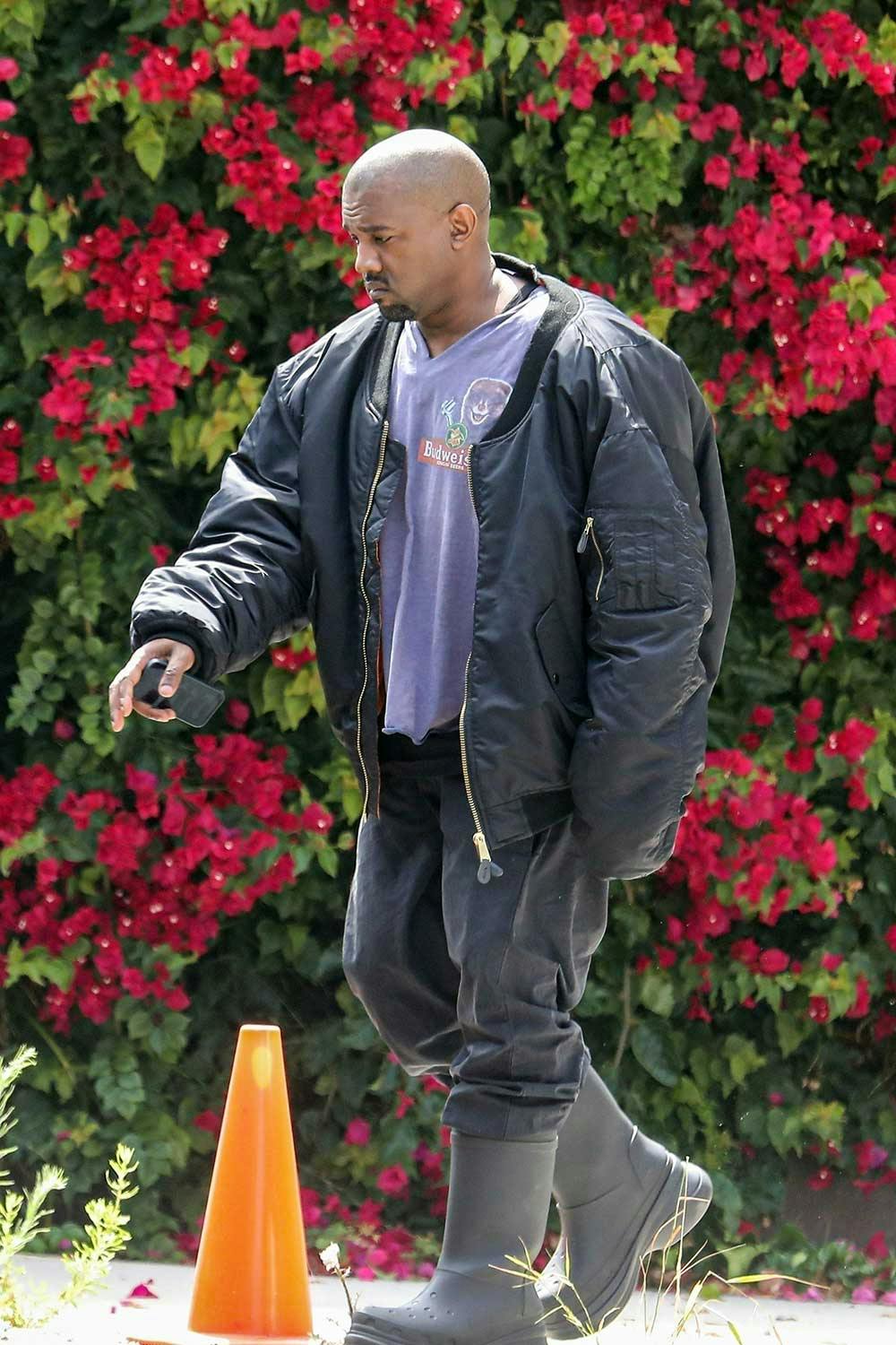 Kanye West Waits for Uber Driver's Car at Tadao Ando House in LA