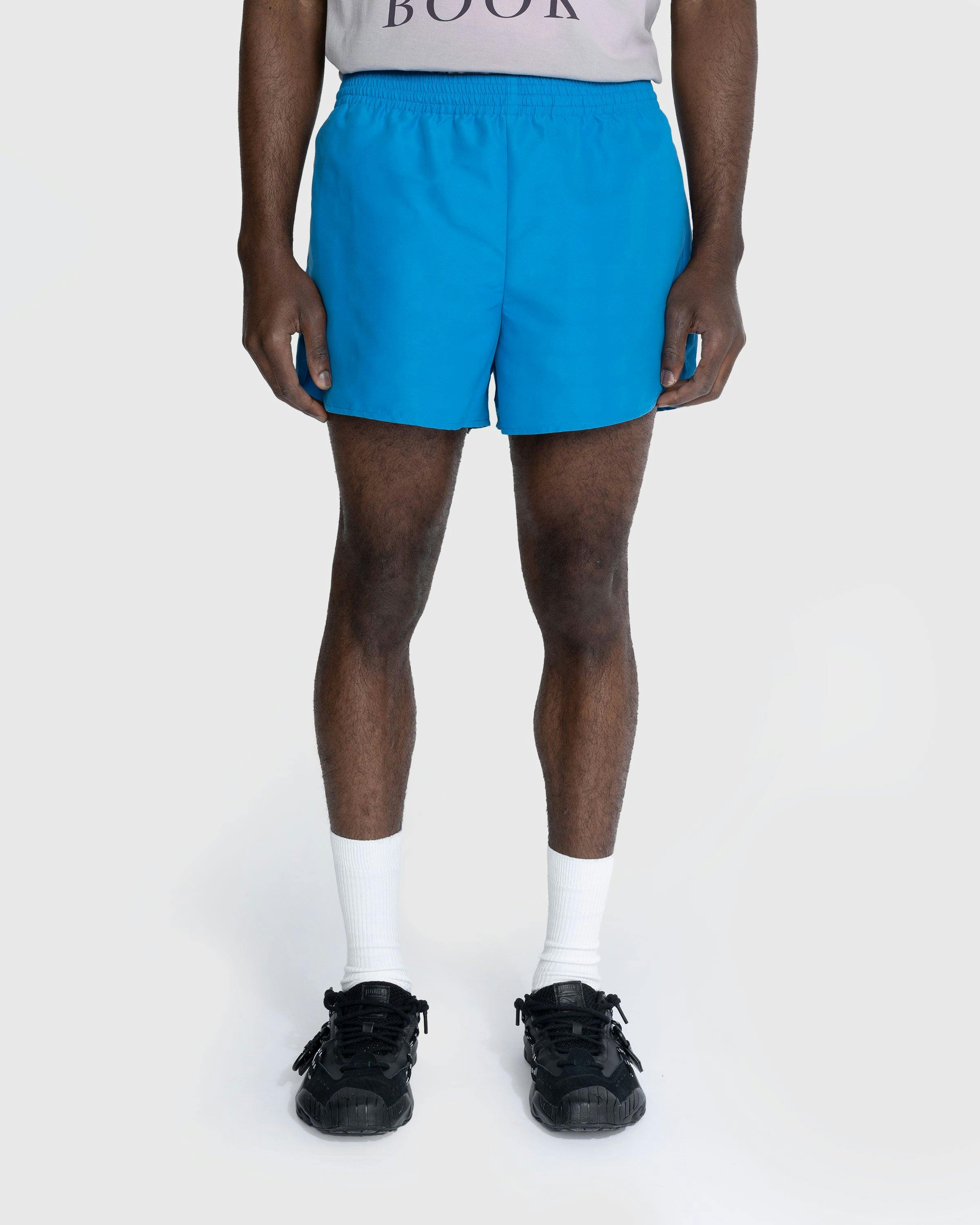 Acne Studios – Water Reactive Logo Swim Shorts Blue | Highsnobiety Shop