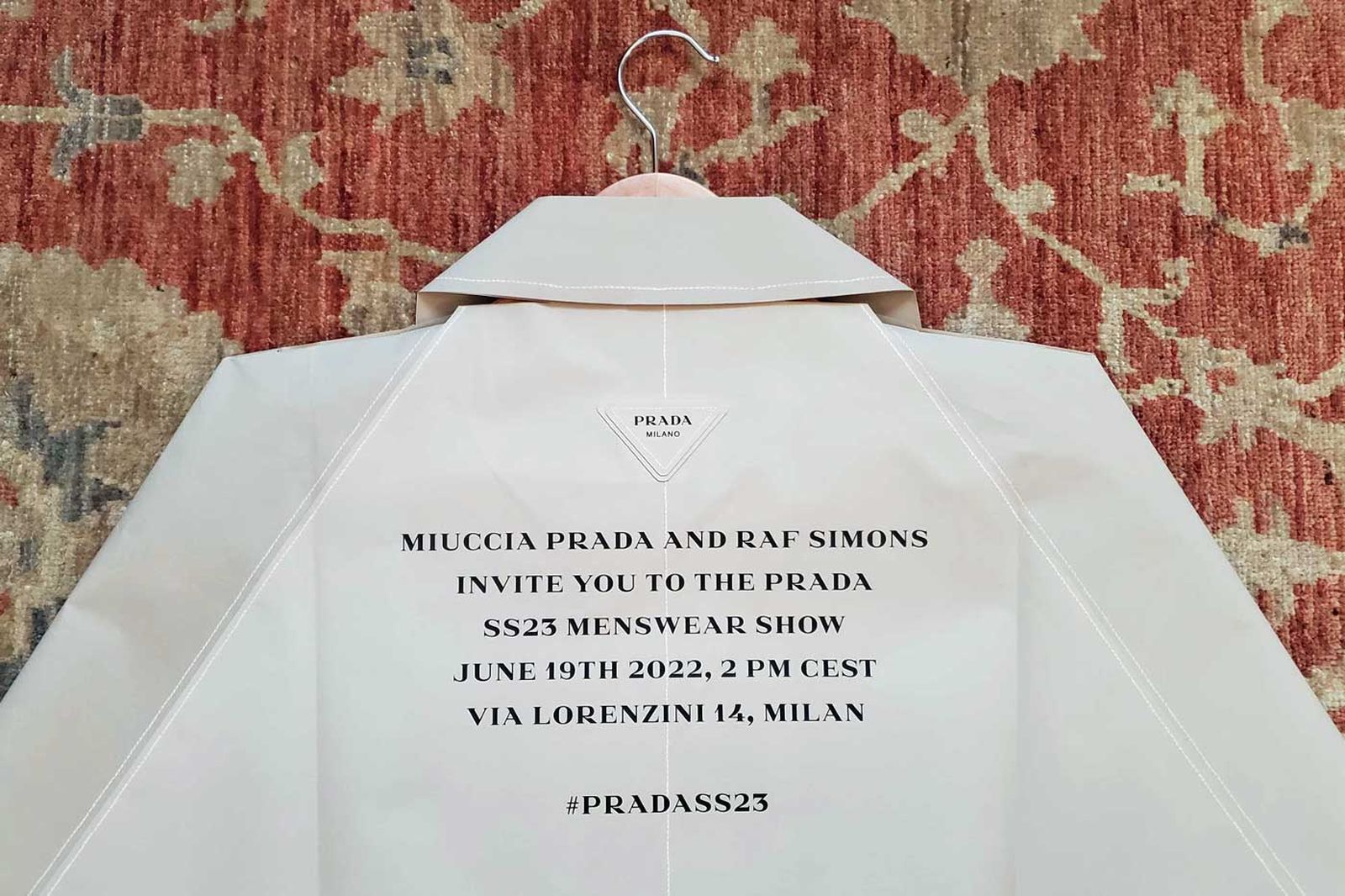 Prada's SS23 Show Invite Is a Paper Coat by Miuccia & Raf Simons