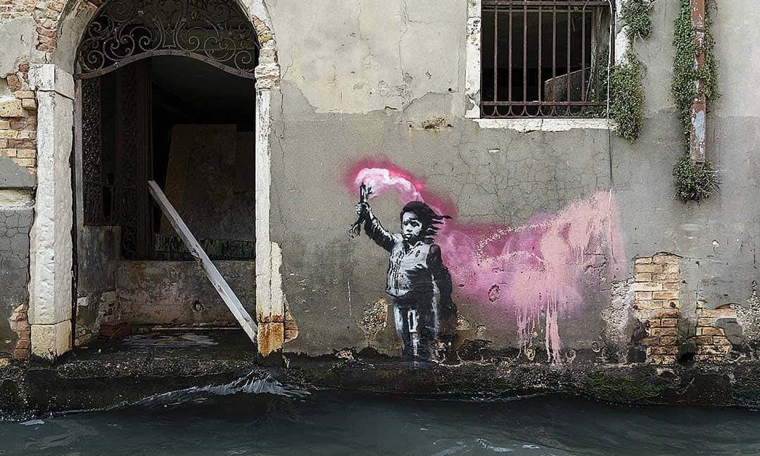 Banksy Depicts a Migrant Child in Venice Mural